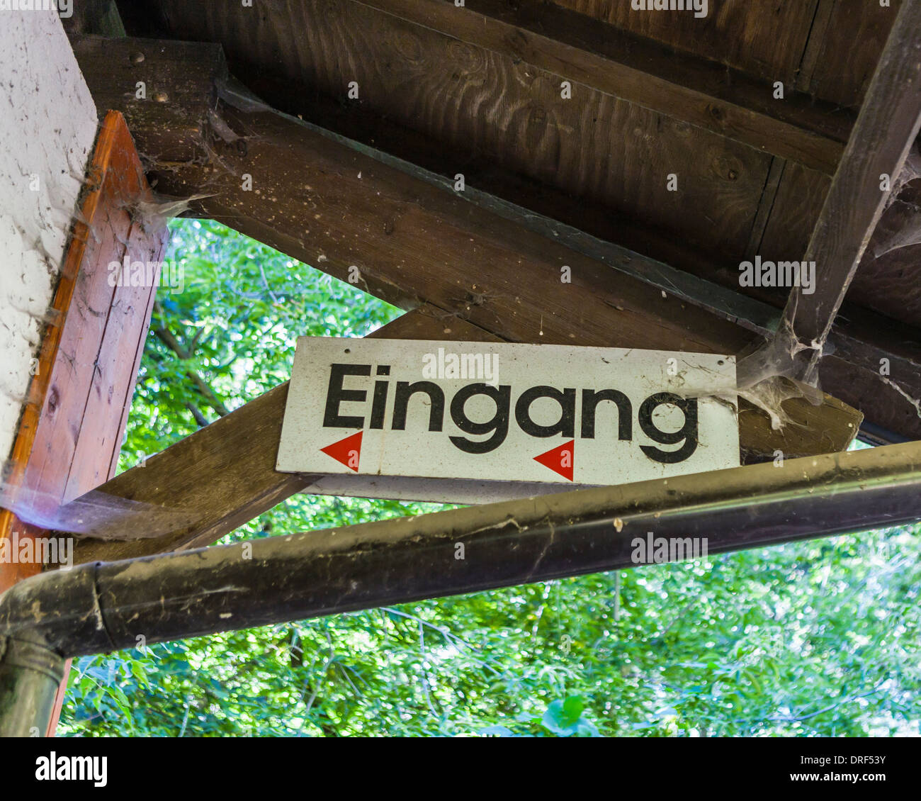 Eingang entrance sign at fun ride covered in grime and cobwebs disused ...