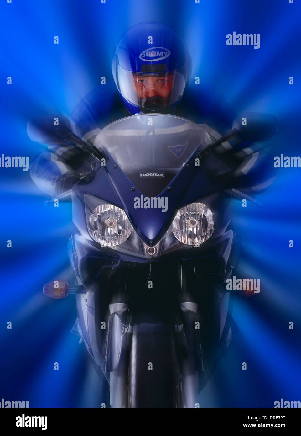Studio speed impression of a man on a motorcycle Stock Photo - Alamy