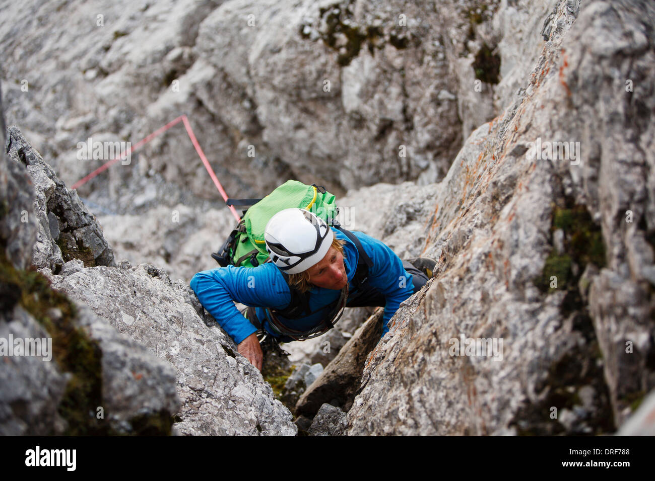 Alpinist climbing in mountains, on the rope, Stubai, Kalkkoegel ...