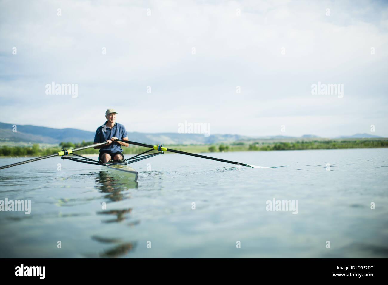 Colorado USA man in rowing boat using the oars Stock Photo - Alamy