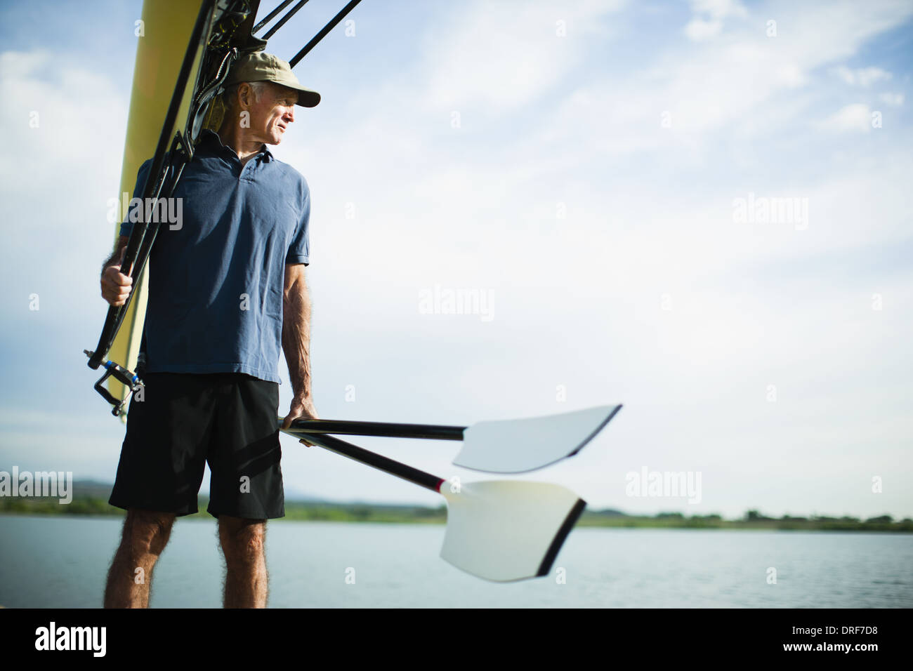 Colorado USA middle-aged man carrying oars and rowing shell Stock Photo ...