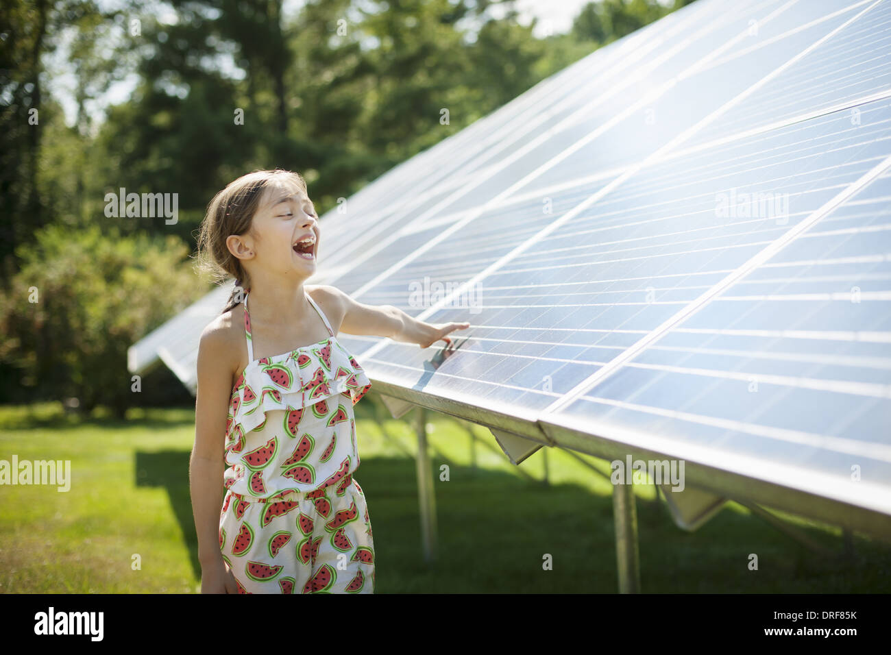 New York state USA child on sunny day beside solar panels USA Stock ...