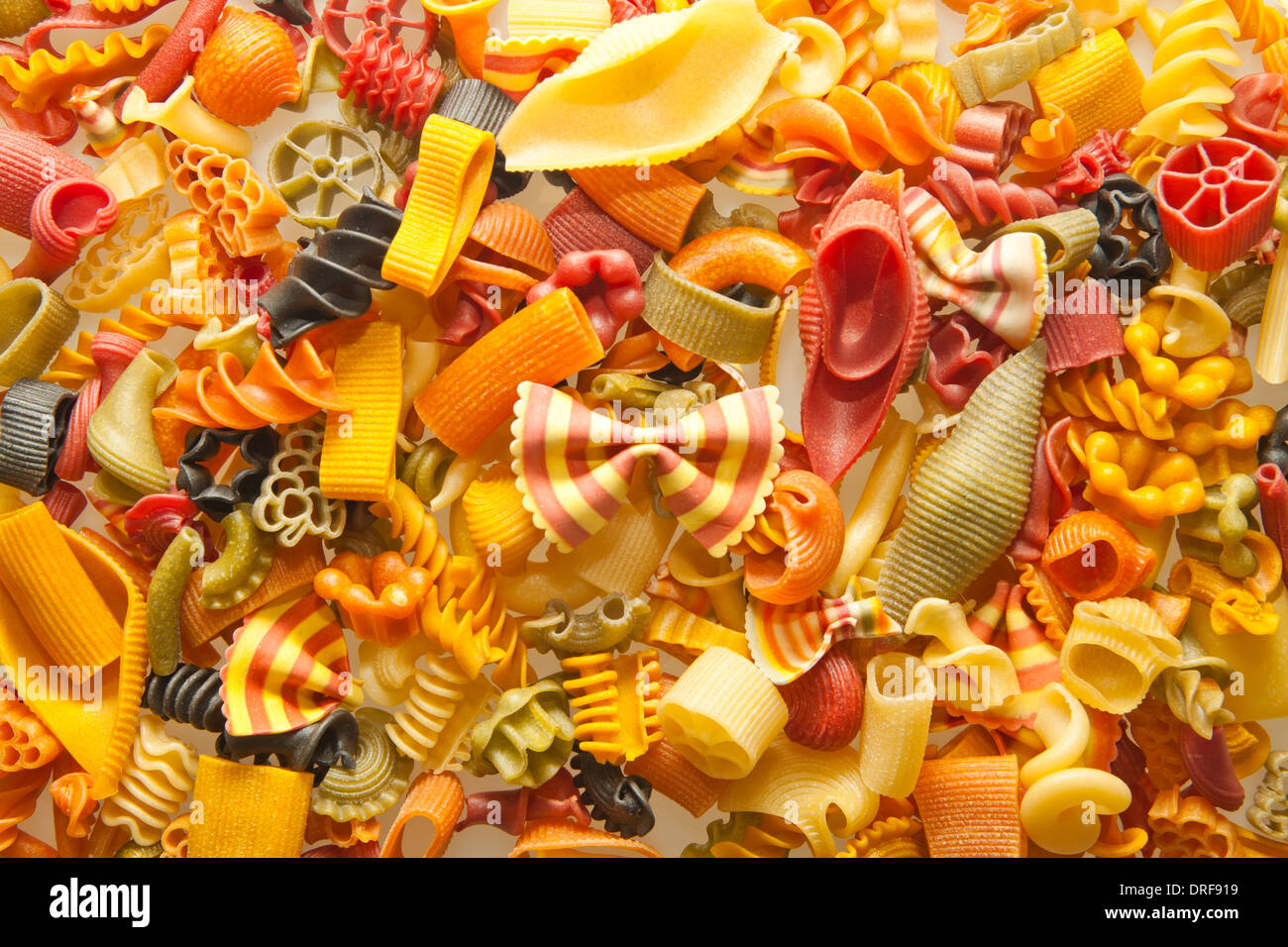 Colourful pasta mix isolated on white background Stock Photo - Alamy