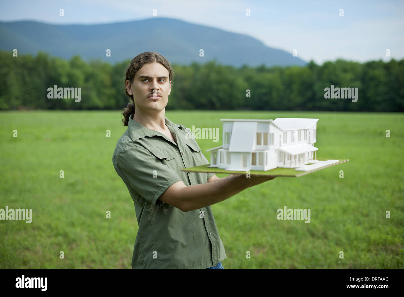 New York state USA rural person holding scale model of new building ...