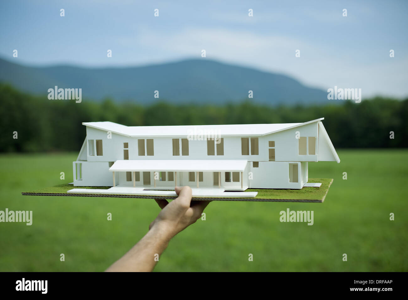New York state USA rural person holding scale model of new building ...