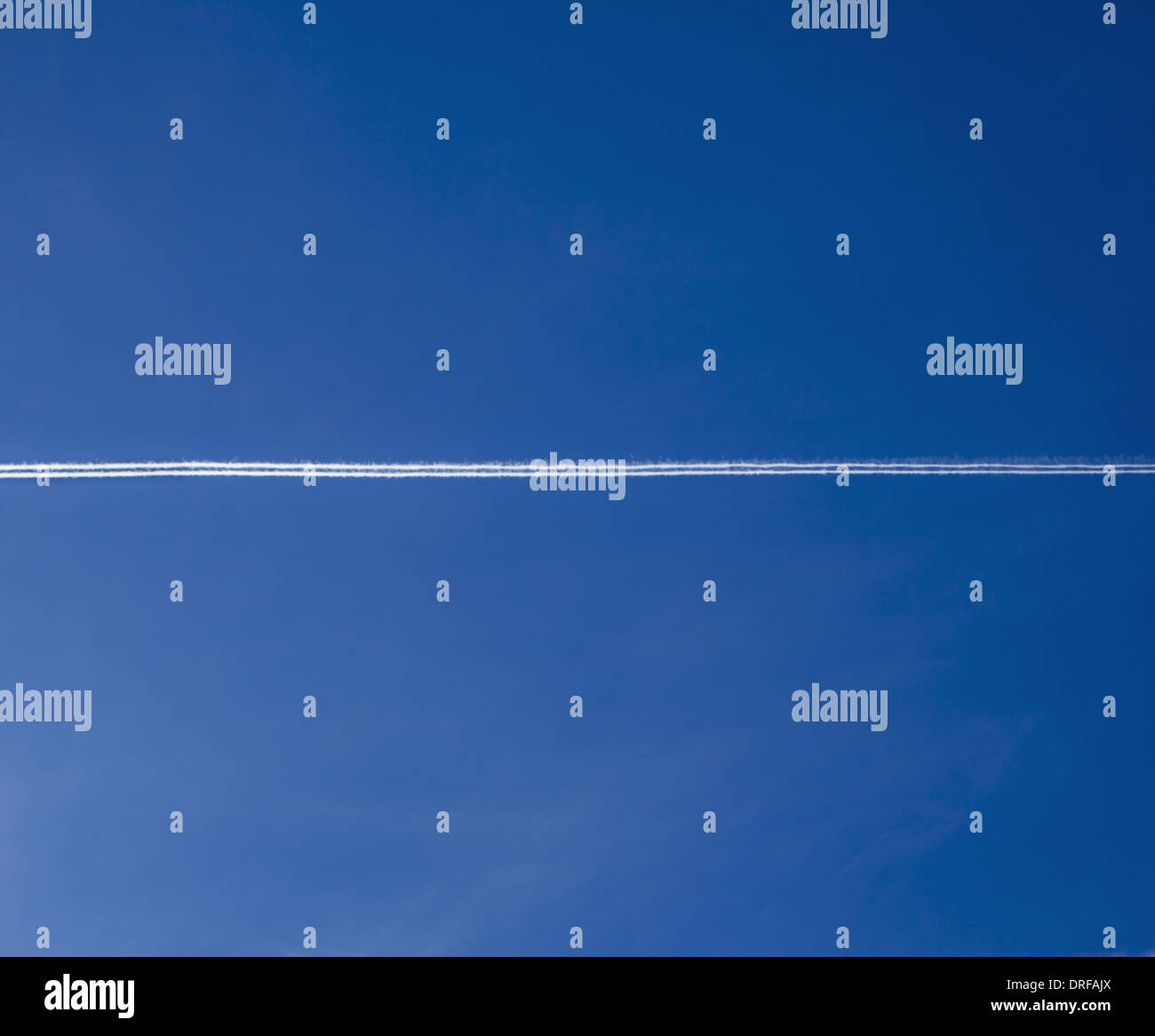 Washington state USA Jet trail across blue sky Stock Photo - Alamy