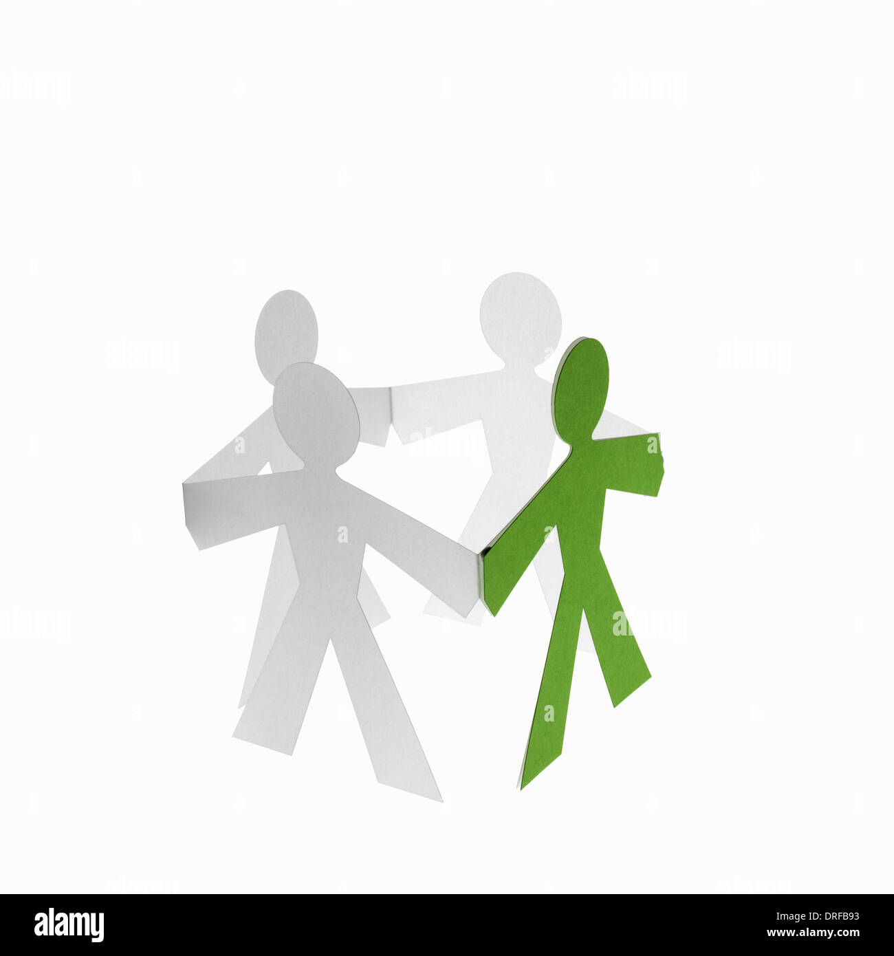Papercuts paper cut out people with joined hands Stock Photo - Alamy