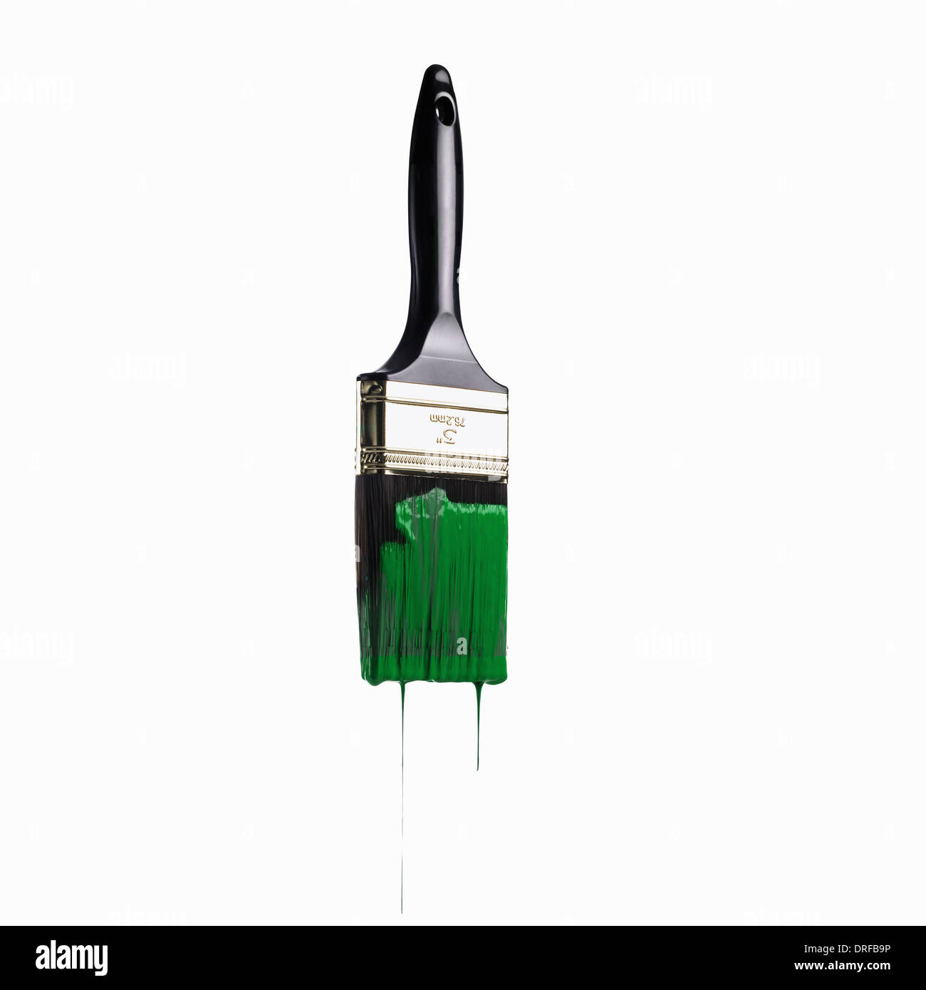 paintbrush loaded with green paint dripping Stock Photo - Alamy