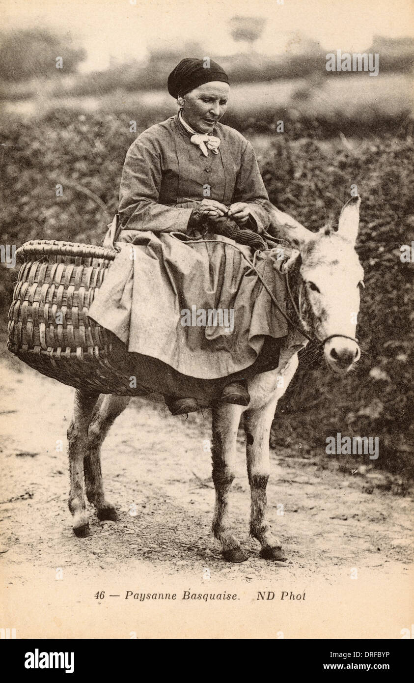 Basque woman riding a donkey Stock Photo - Alamy