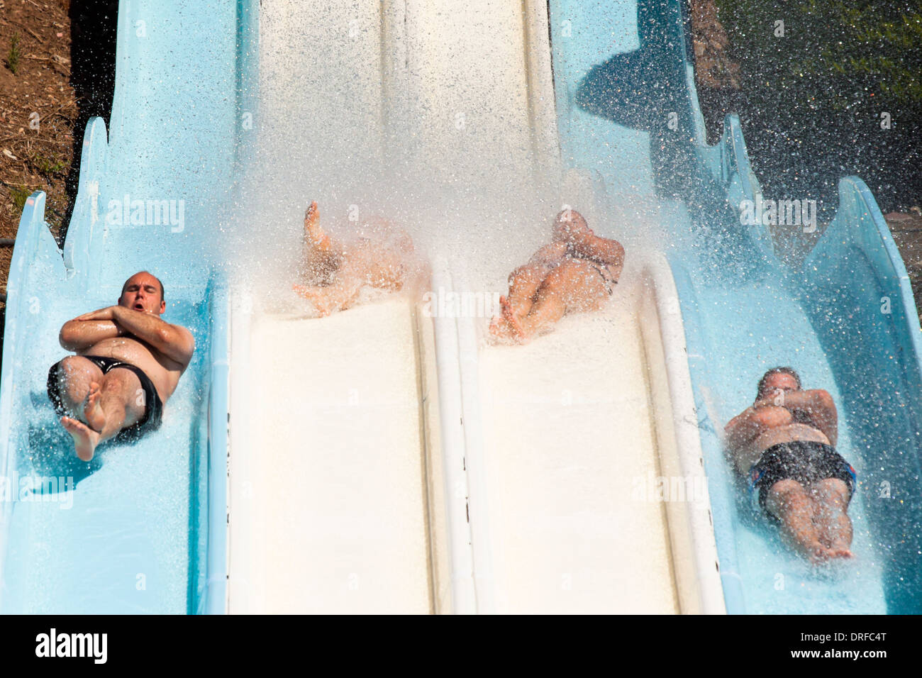 People having fun, sliding at water park Stock Photo - Alamy
