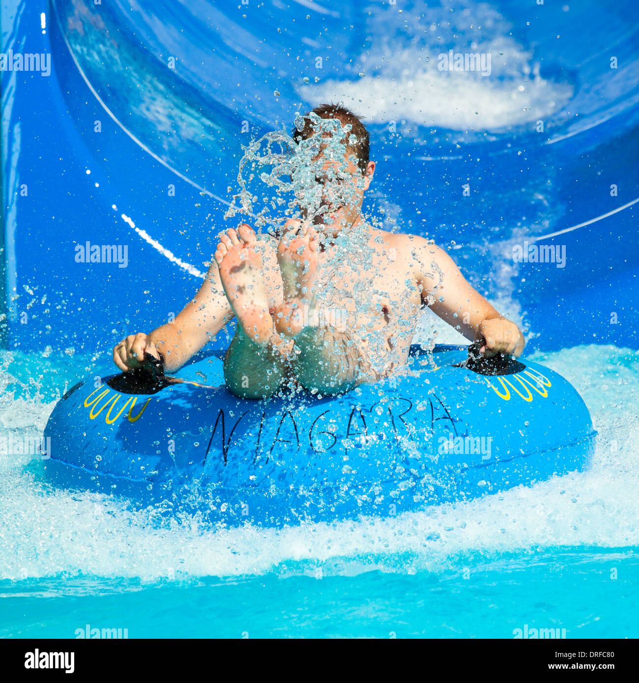 Man water sliding aqua park hi-res stock photography and images - Alamy