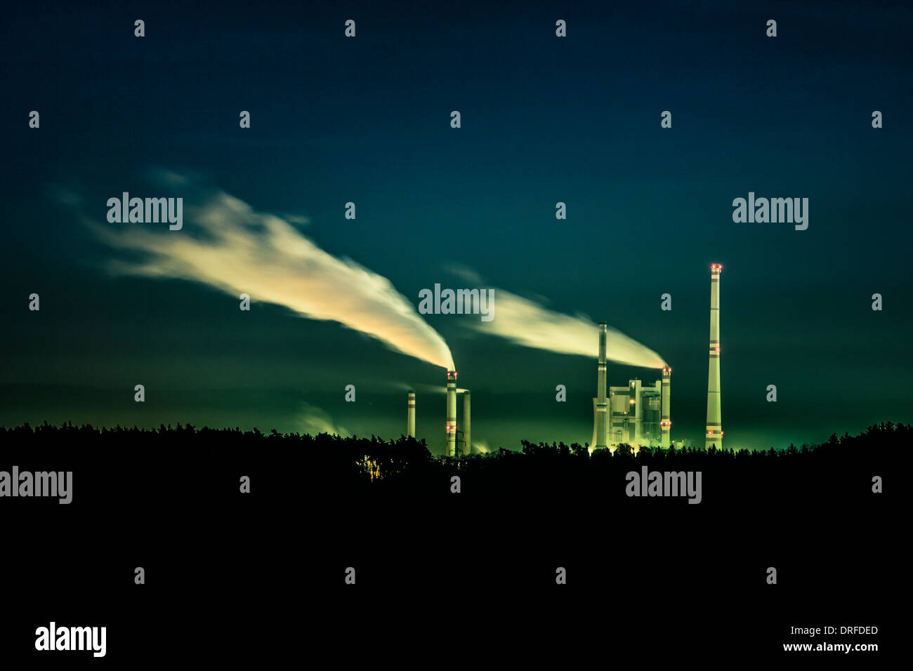 Smoking factory at night Stock Photo - Alamy