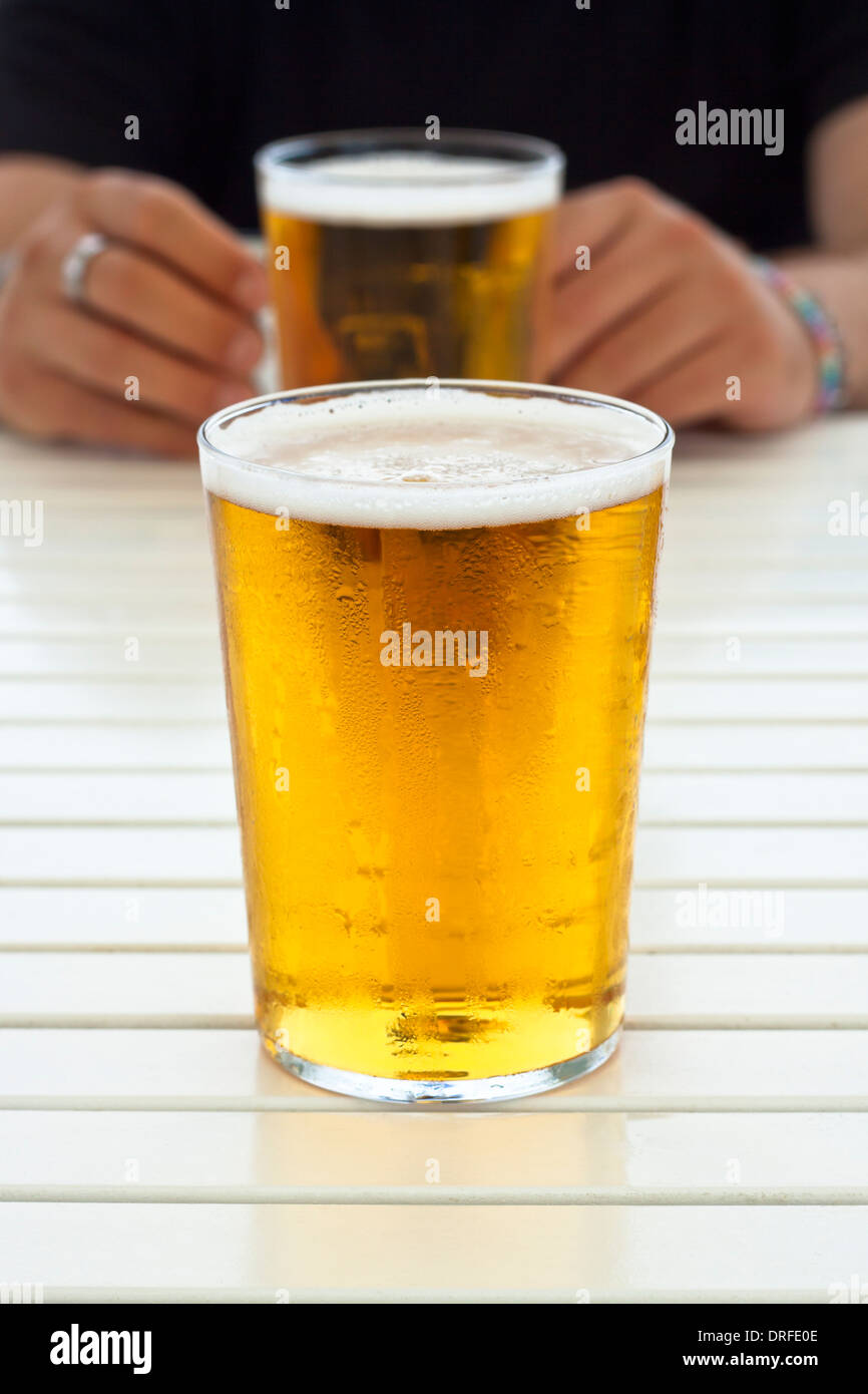 Glass beer pub alcohol hands hi-res stock photography and images - Alamy