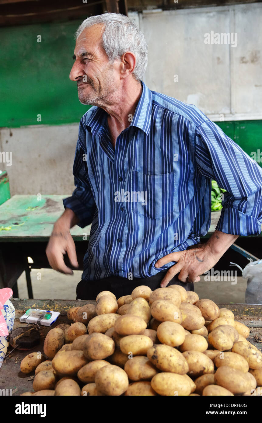 A man sells potatoes in Armenian bazaar, Yerevan, Armenia Stock Photo ...