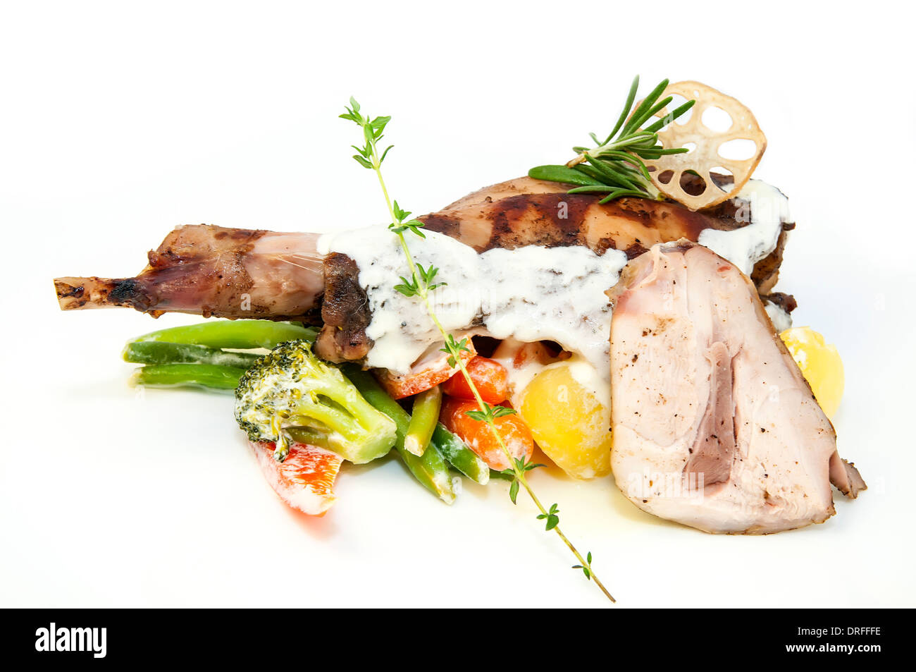Roasted rabbit meat and potatoes with vegetables Stock Photo - Alamy