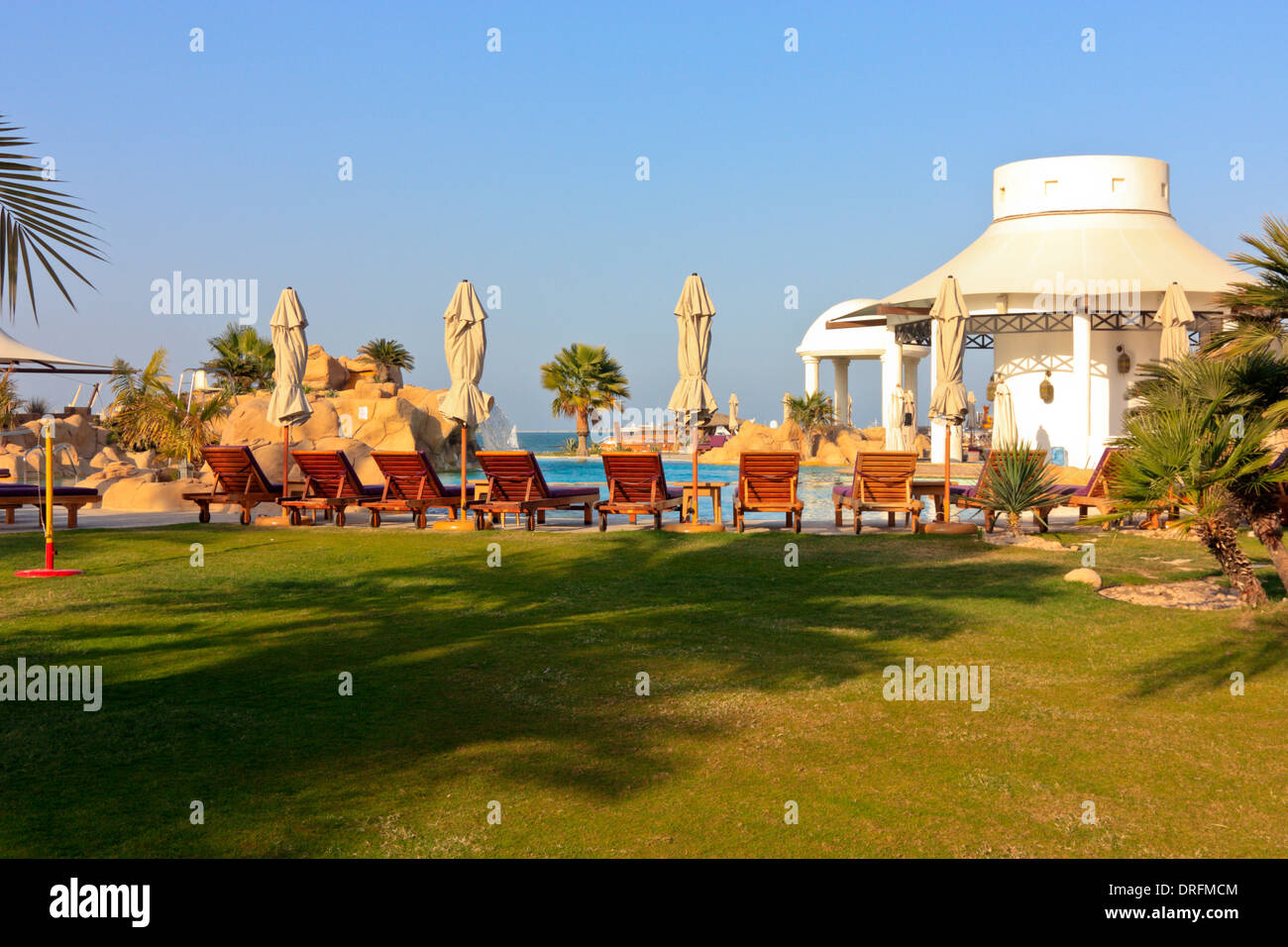 Lawn and Swimming Pool of a Luxury Hotel in Doha, Qatar Stock Photo - Alamy