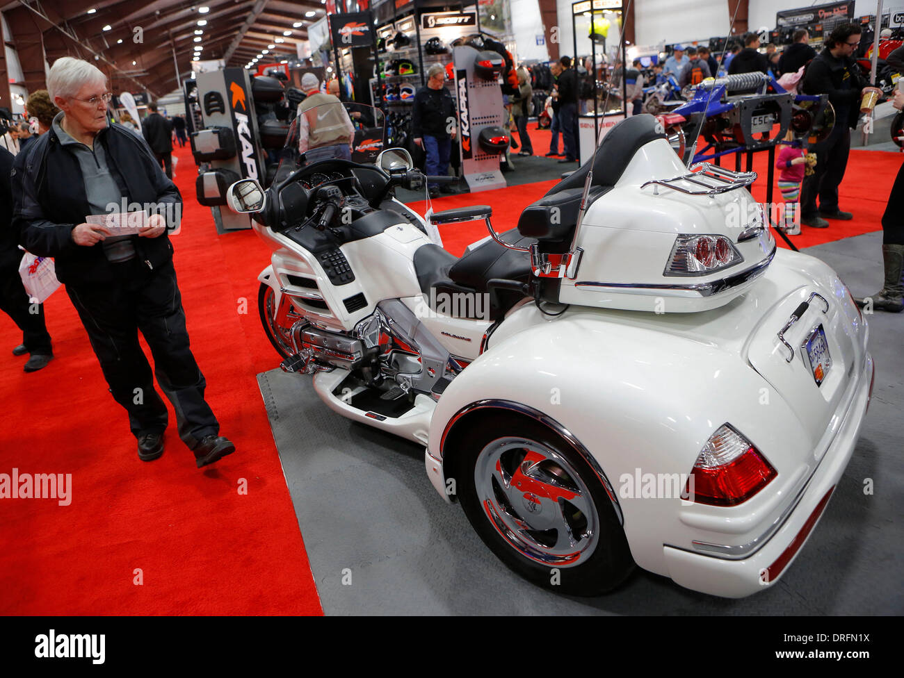 Abbotsford, Canada. 24th January 2014. A visitor looks at a motorcycle ...