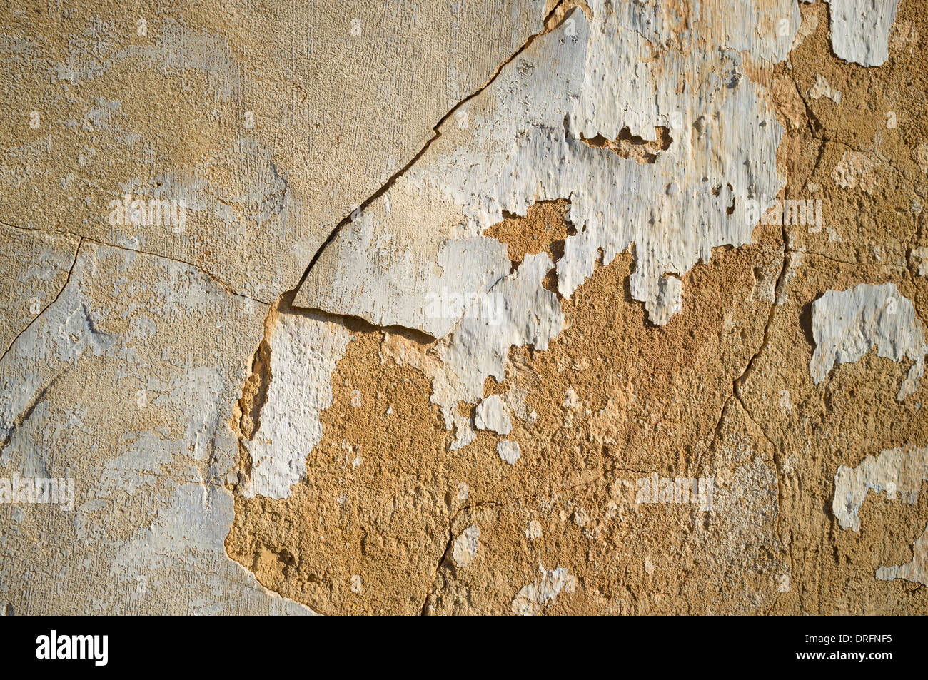 Full frame take of the cracked plaster on and adobe wall Stock Photo ...
