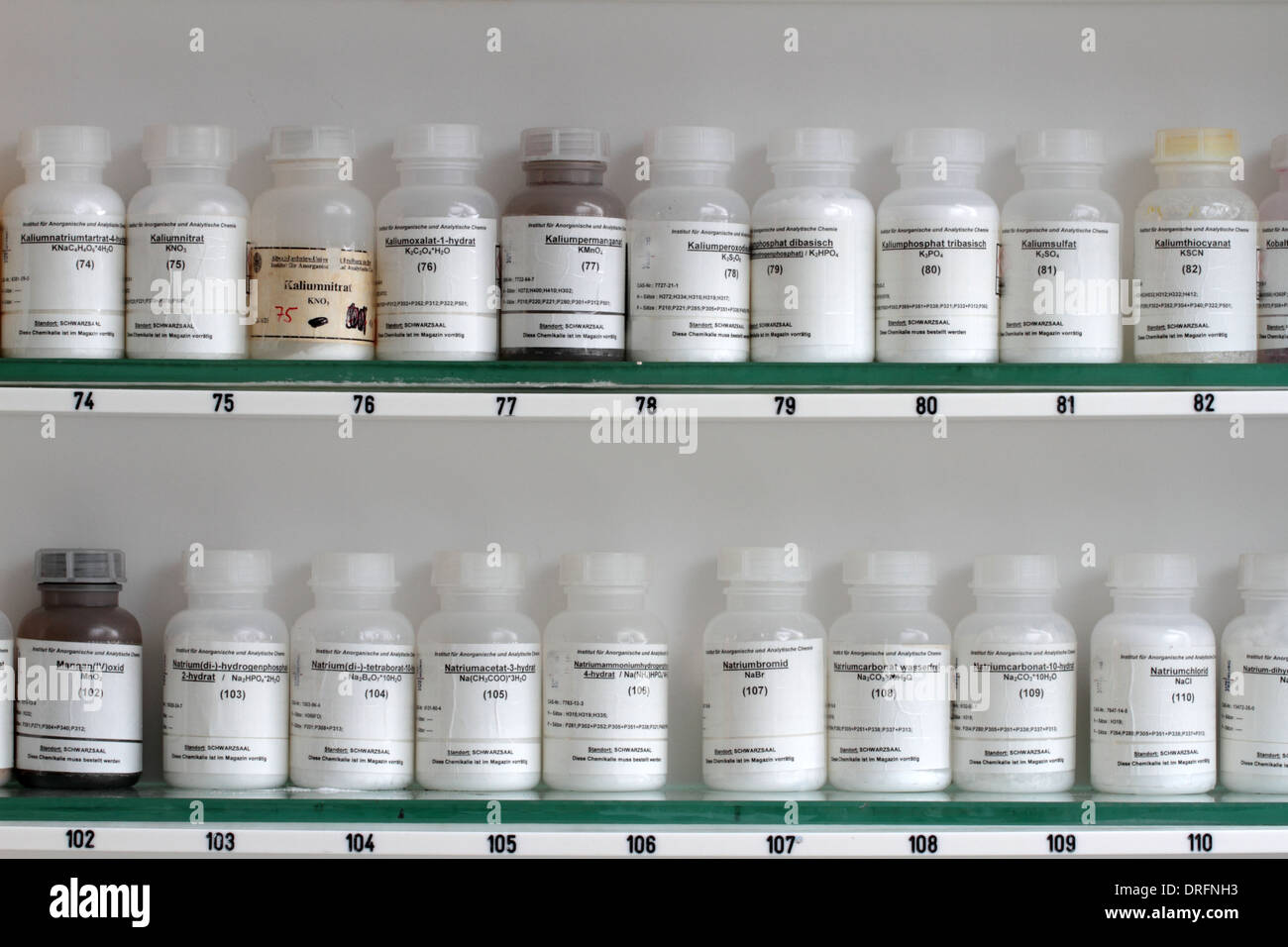 chemistry in a shelf plastic bottle in a chemical lab Stock Photo - Alamy