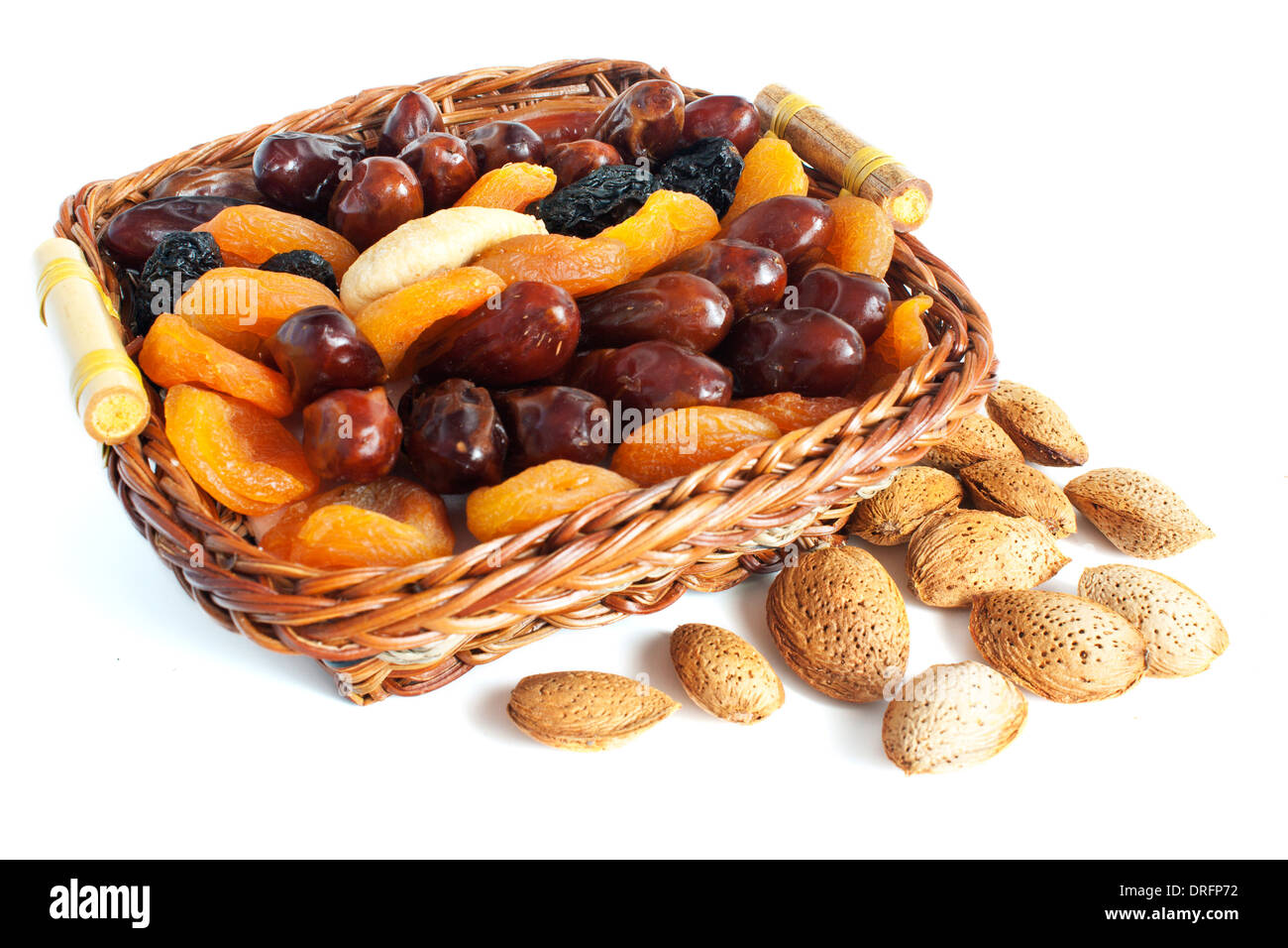 Almonds and dry fruits isolated on white background Stock Photo - Alamy