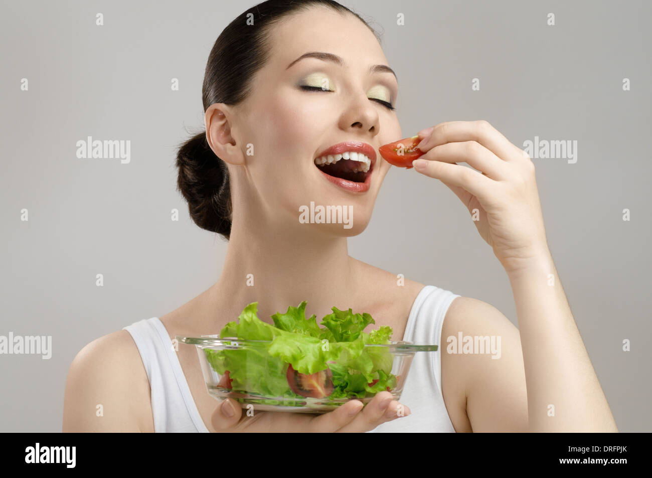 A beautiful slender girl eating healthy food Stock Photo - Alamy