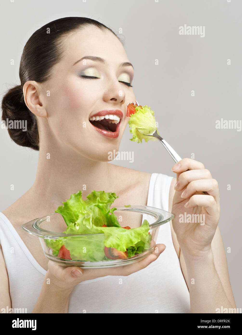 A beautiful slender girl eating healthy food Stock Photo - Alamy
