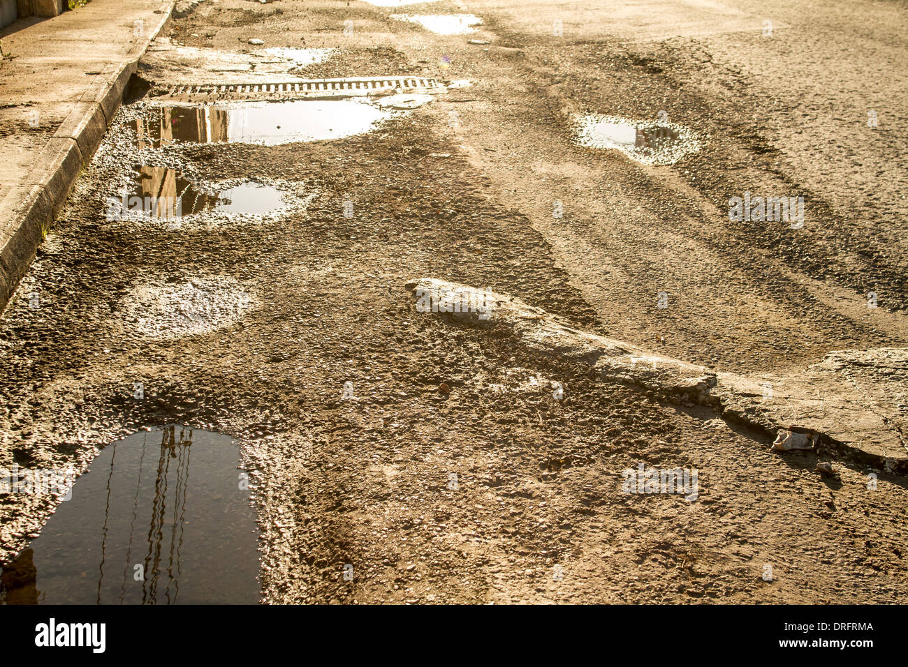 Broken road surface hi-res stock photography and images - Alamy