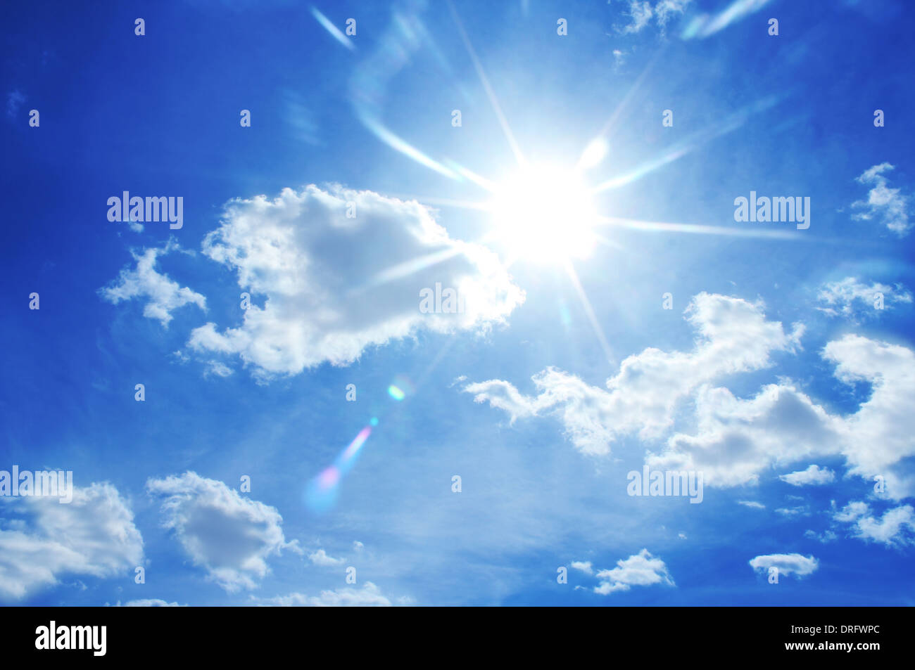 Cloudy sky with sun Stock Photo - Alamy