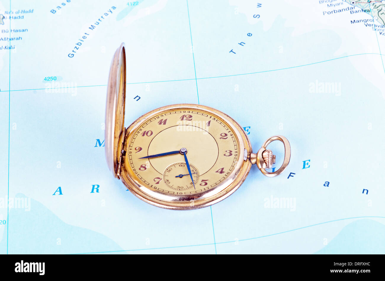 Photo of old watch on map Stock Photo - Alamy