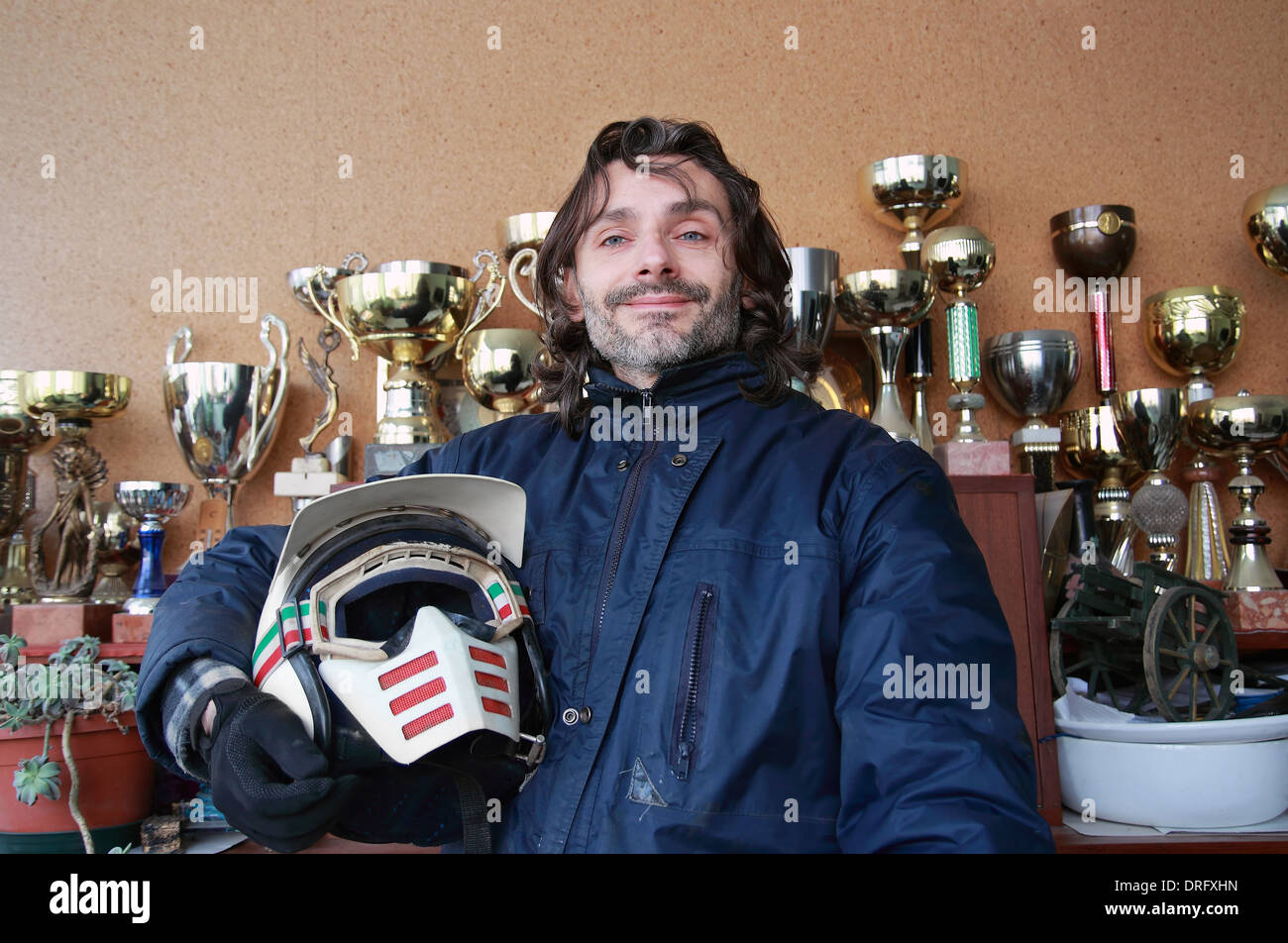 Pilot pose with helmet over a victory cup background Stock Photo - Alamy