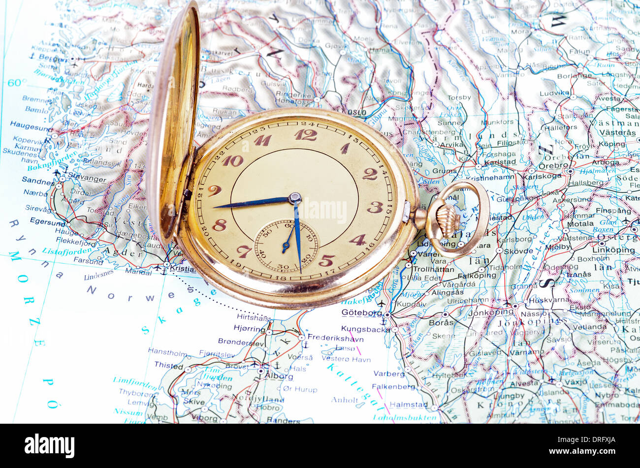 Photo of old watch on map Stock Photo - Alamy