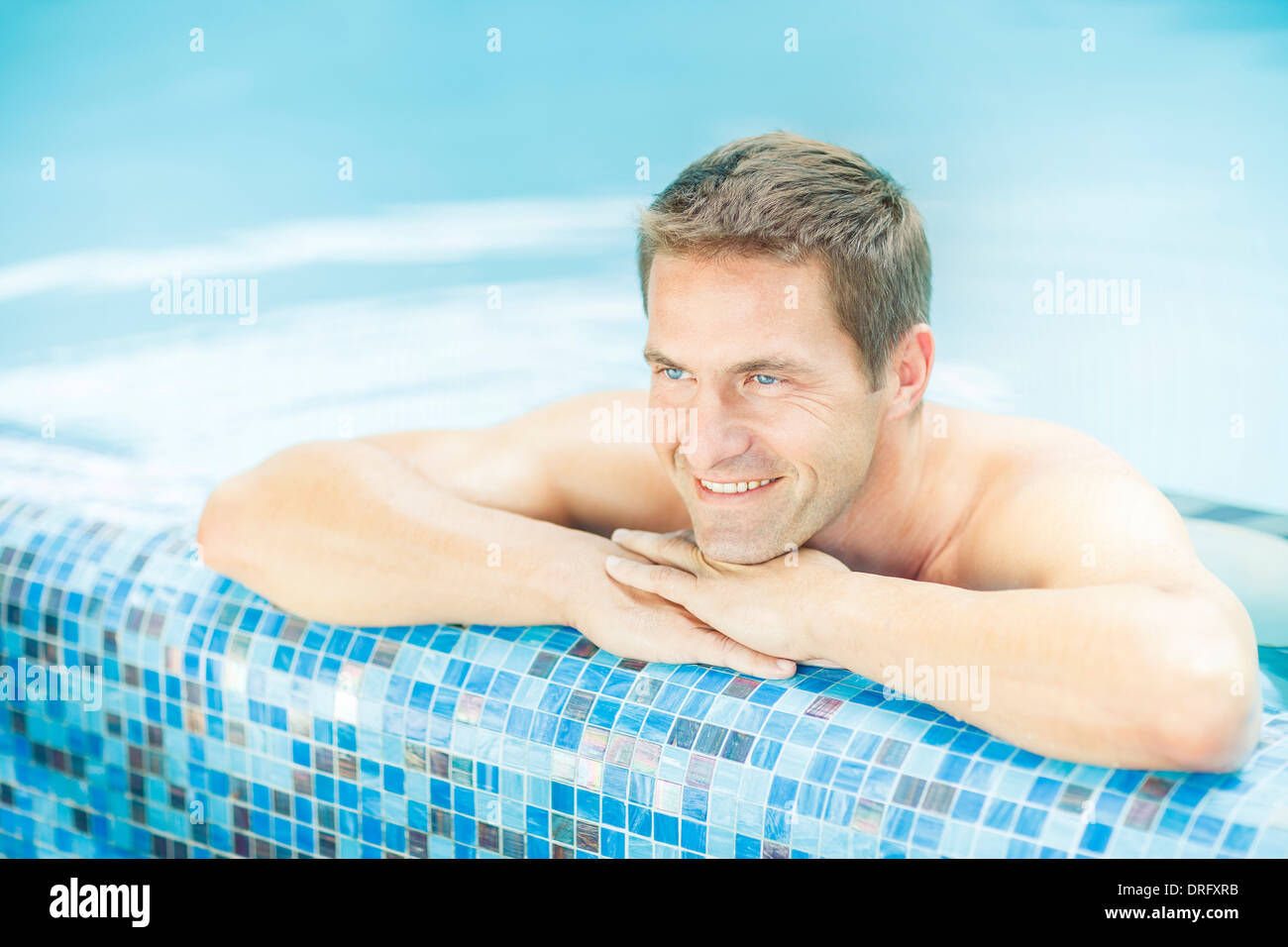 Man in swimming pool resting head on hands, Dubrovnik, Croatia Stock ...