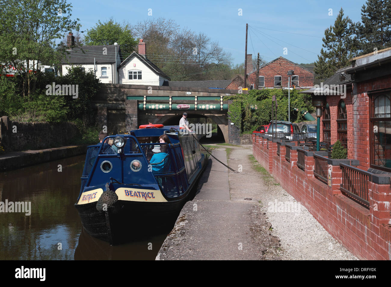 A narrowboat approaching lock 13 of the Cheddleton Locks on the Caldon ...