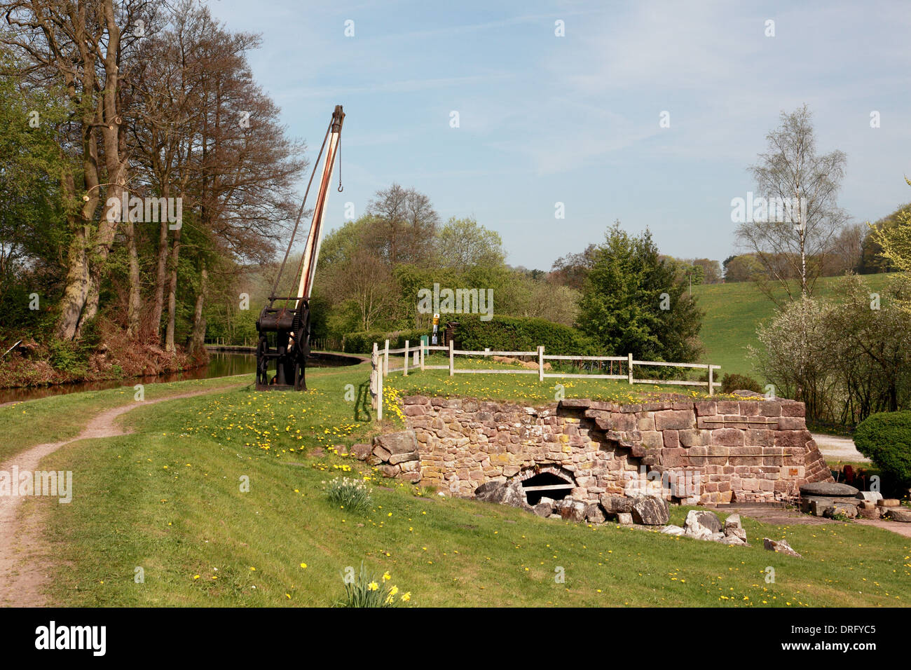 The Caldon Canal and crane next to an old kiln at Cheddleton Flint Mill ...