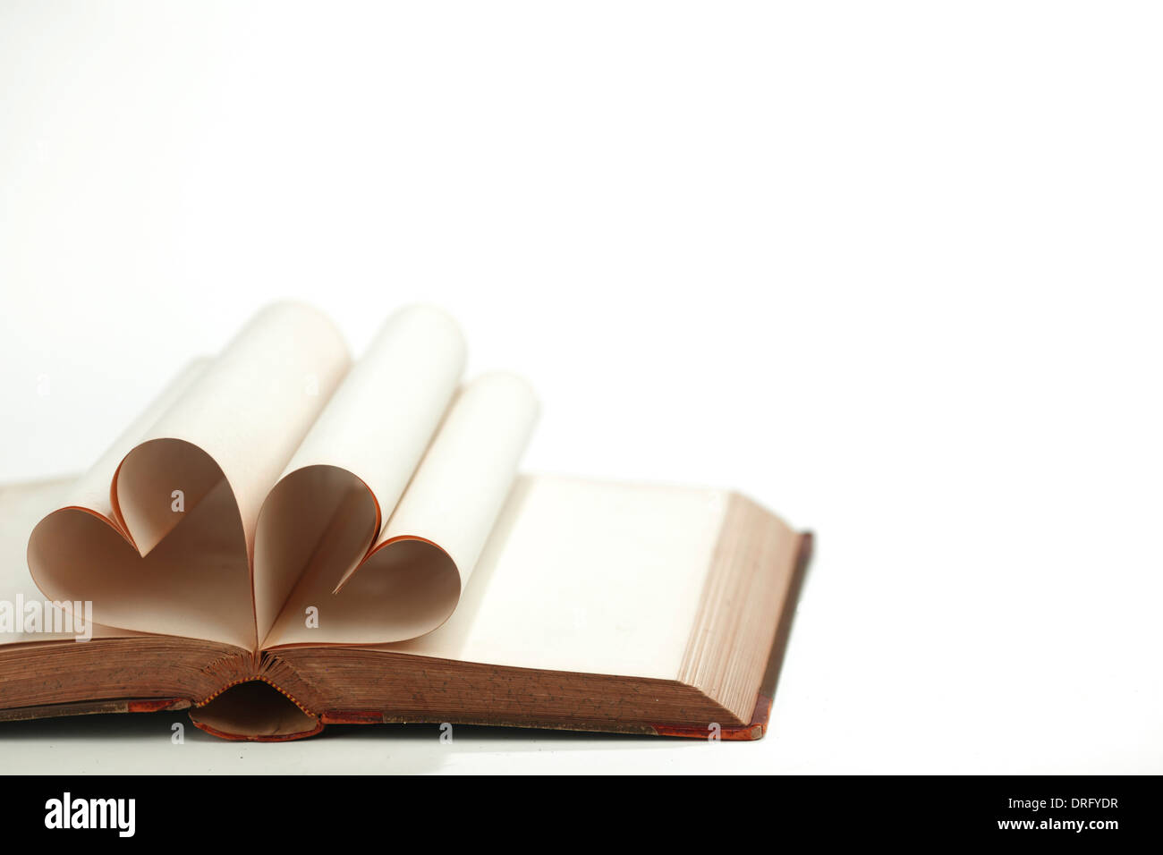 Heart made of blank pages inside a book on white background Stock Photo ...