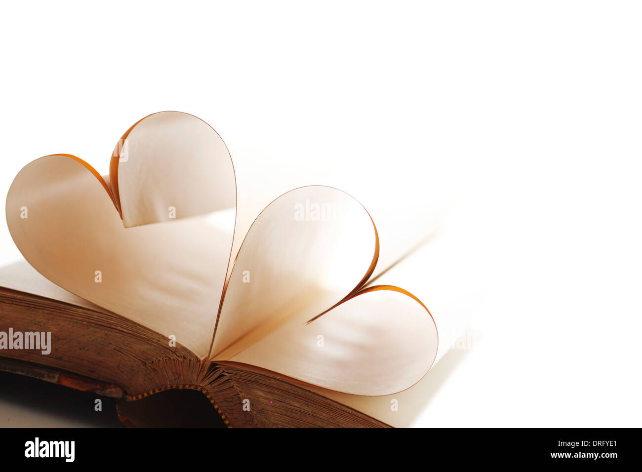 Heart made of blank pages inside a book on white background Stock Photo ...