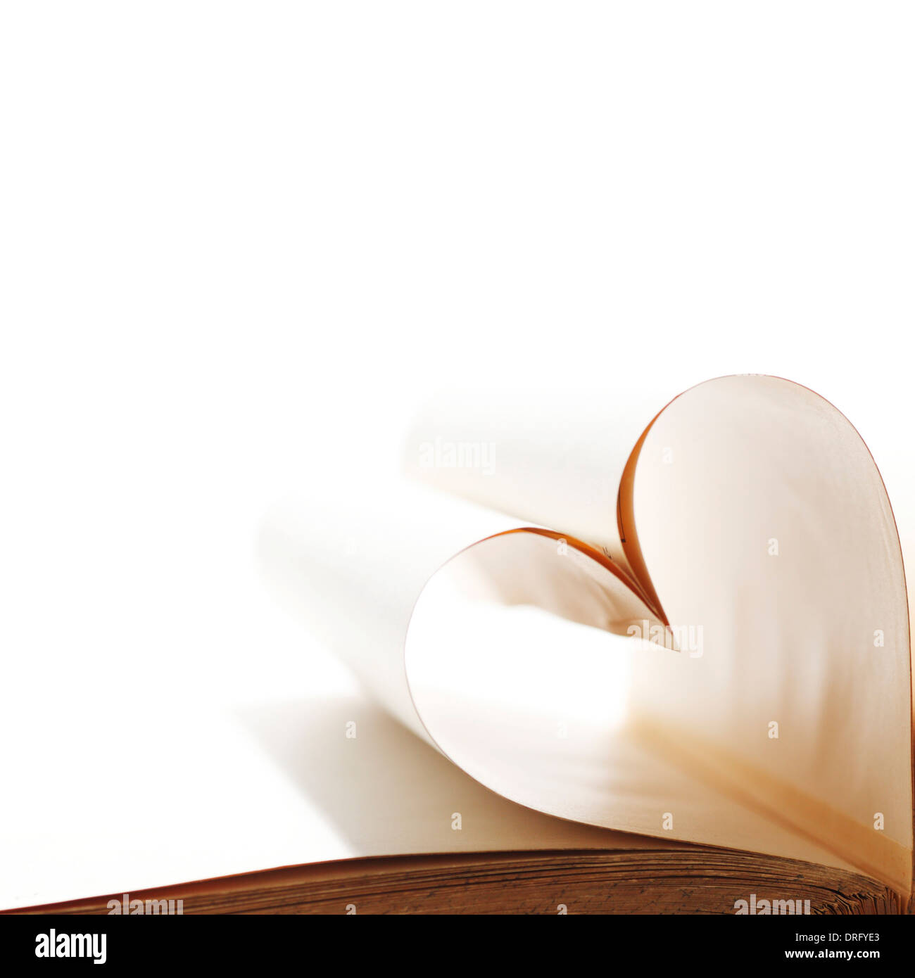Heart made of blank pages inside a book on white background Stock Photo ...
