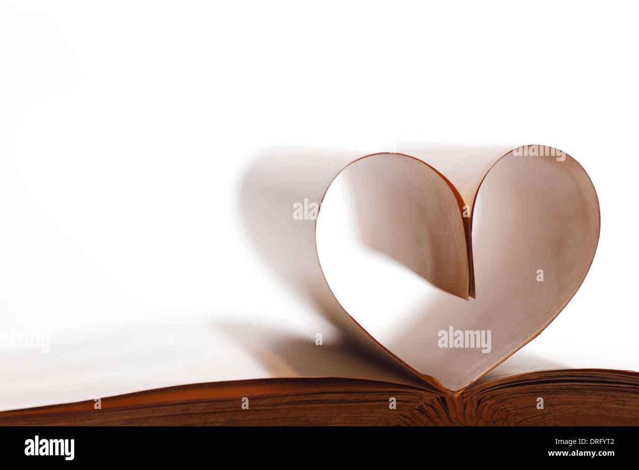 Heart made of blank pages inside a book on white background Stock Photo ...