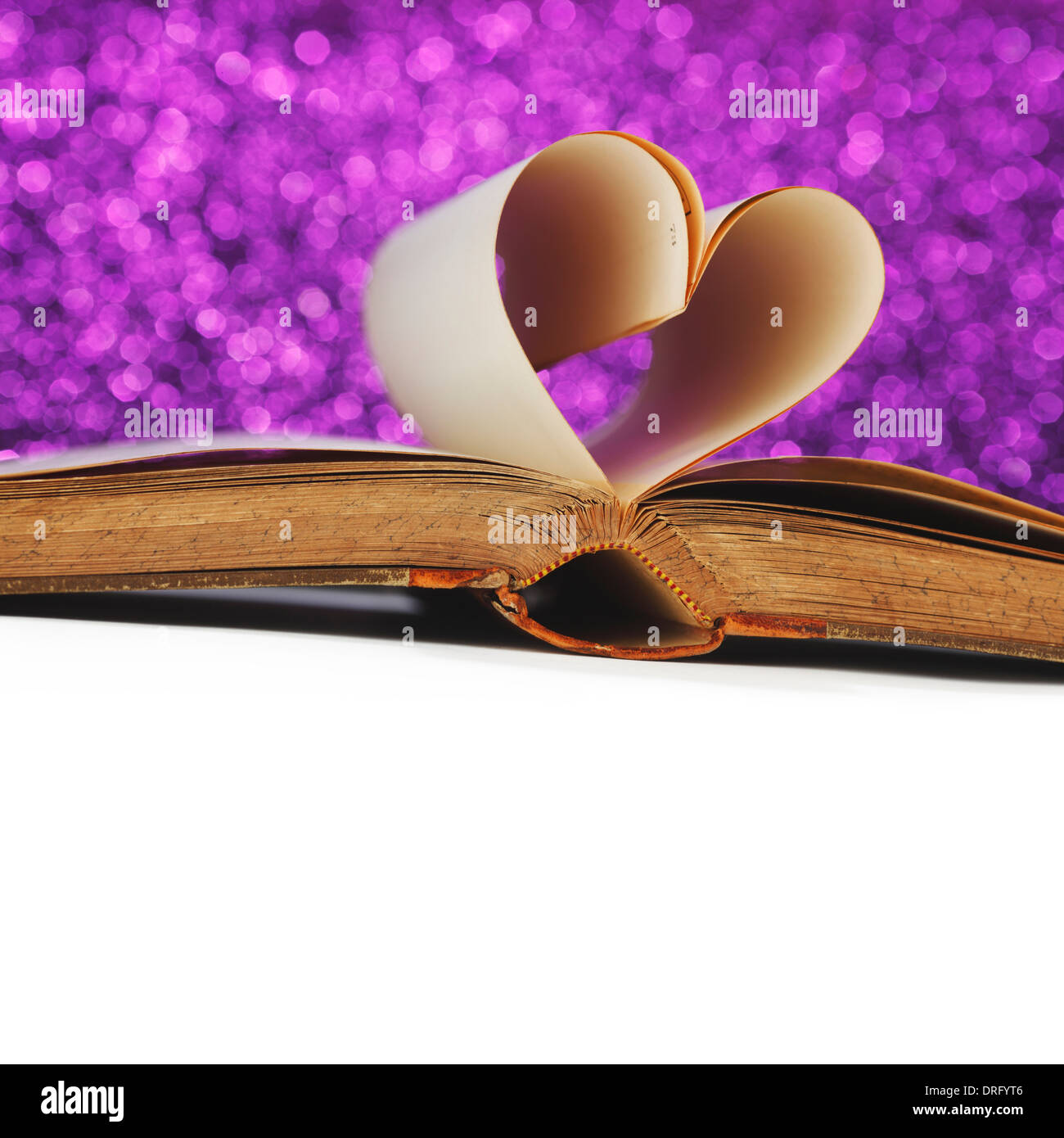 Heart made of blank pages inside a book on glitter background Stock ...