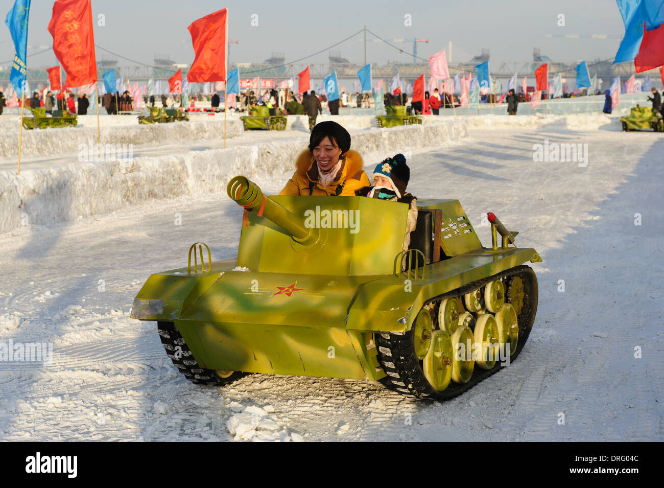 Winter fun on the frozen Songhua river. Harbin, China. Mother and sun ...