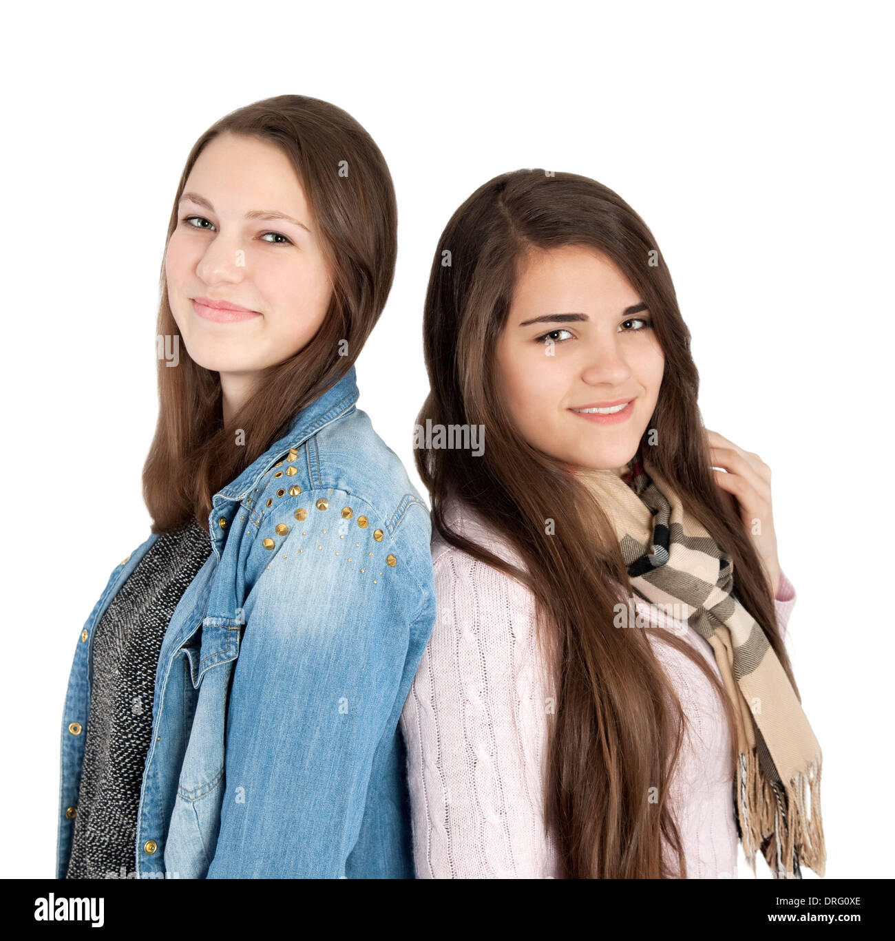 two teenage girls back to back Stock Photo - Alamy