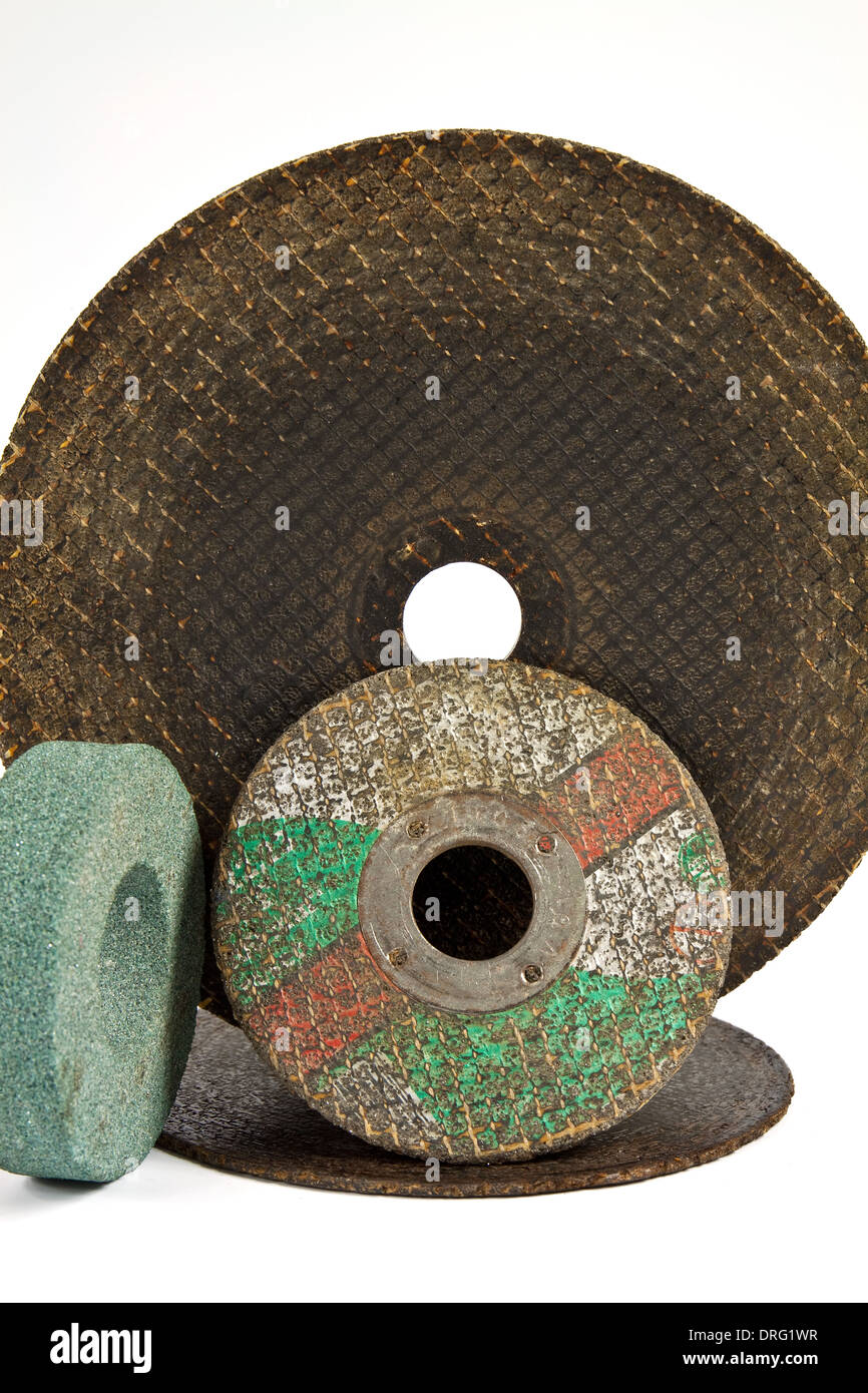 Different sizes used discs and emery grinder Stock Photo - Alamy