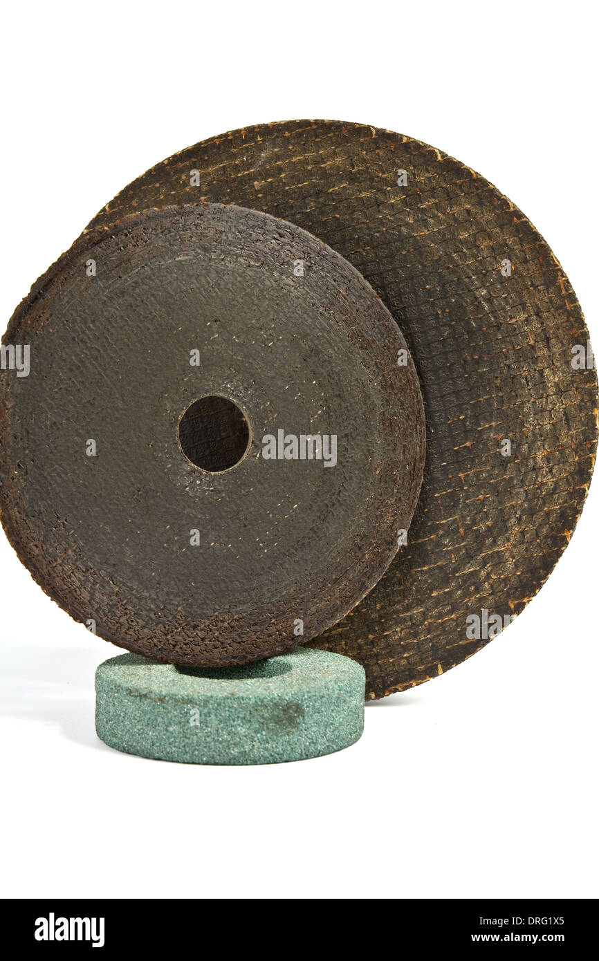 Different sizes used discs and emery grinder Stock Photo - Alamy