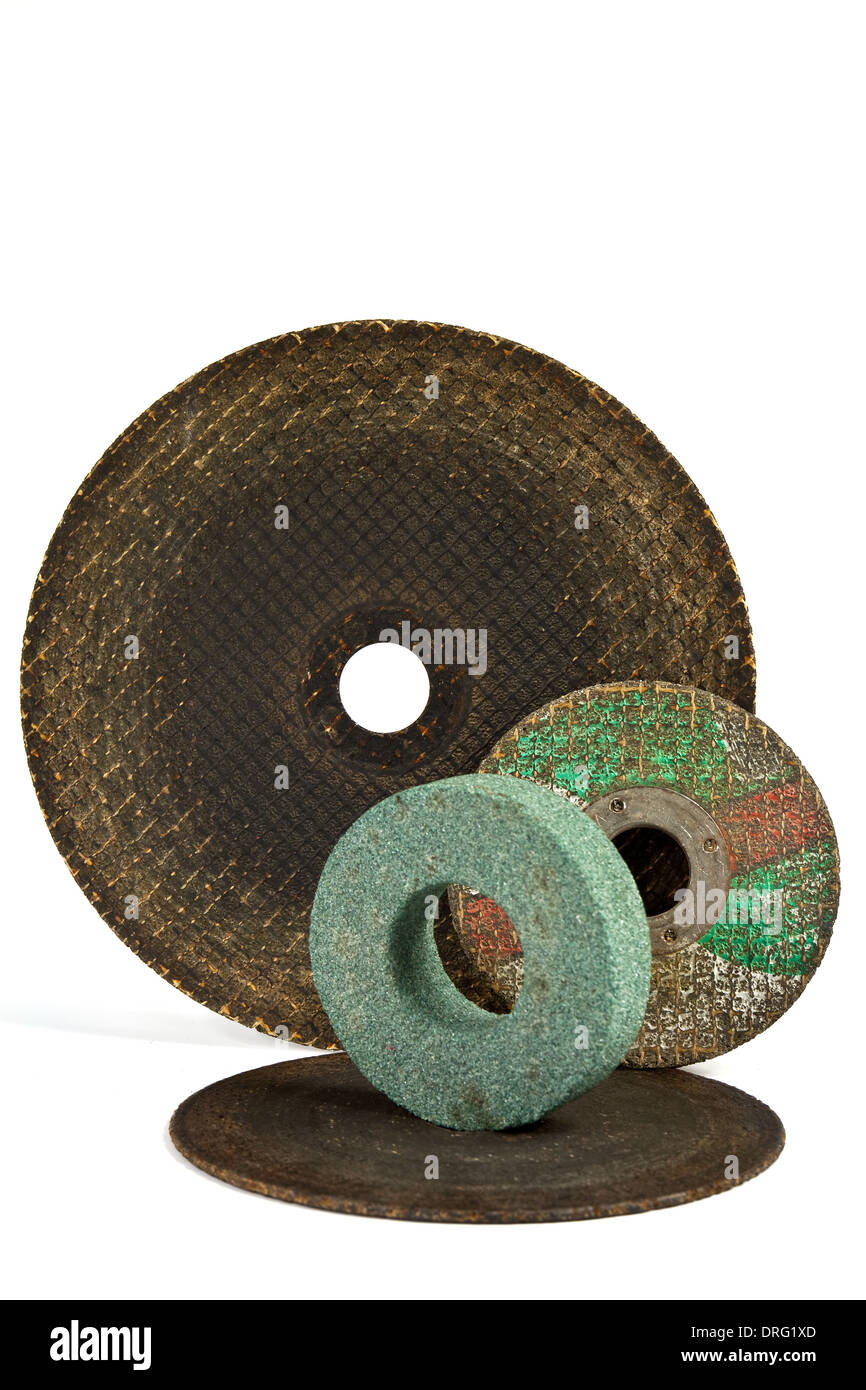 Different sizes used discs and emery grinder Stock Photo - Alamy