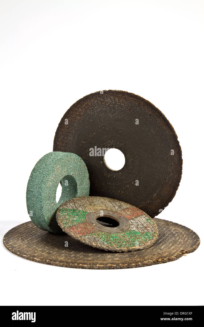 Different sizes used discs and emery grinder Stock Photo - Alamy