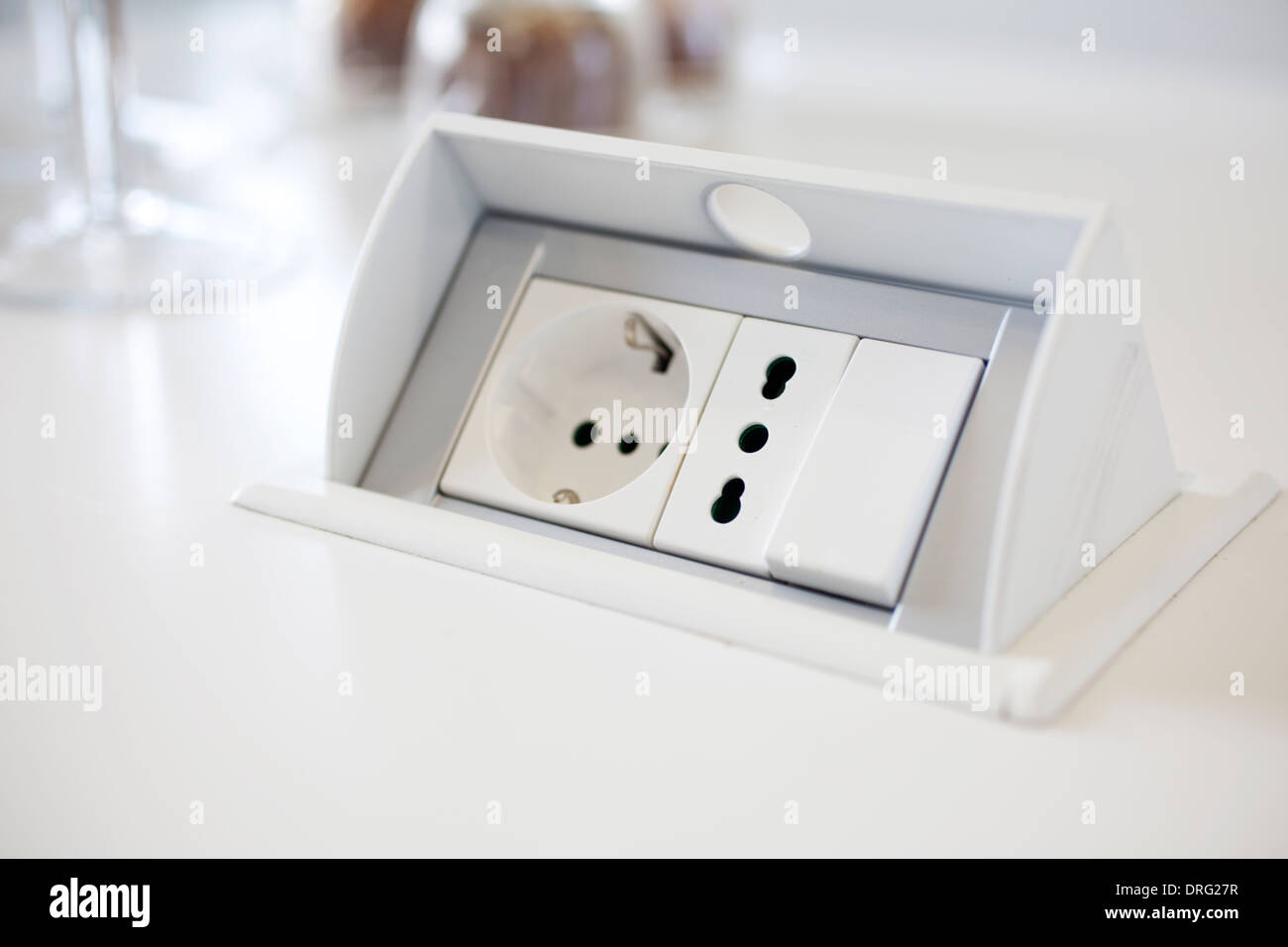 Kitchen electrical plug hidden on the counter Stock Photo - Alamy