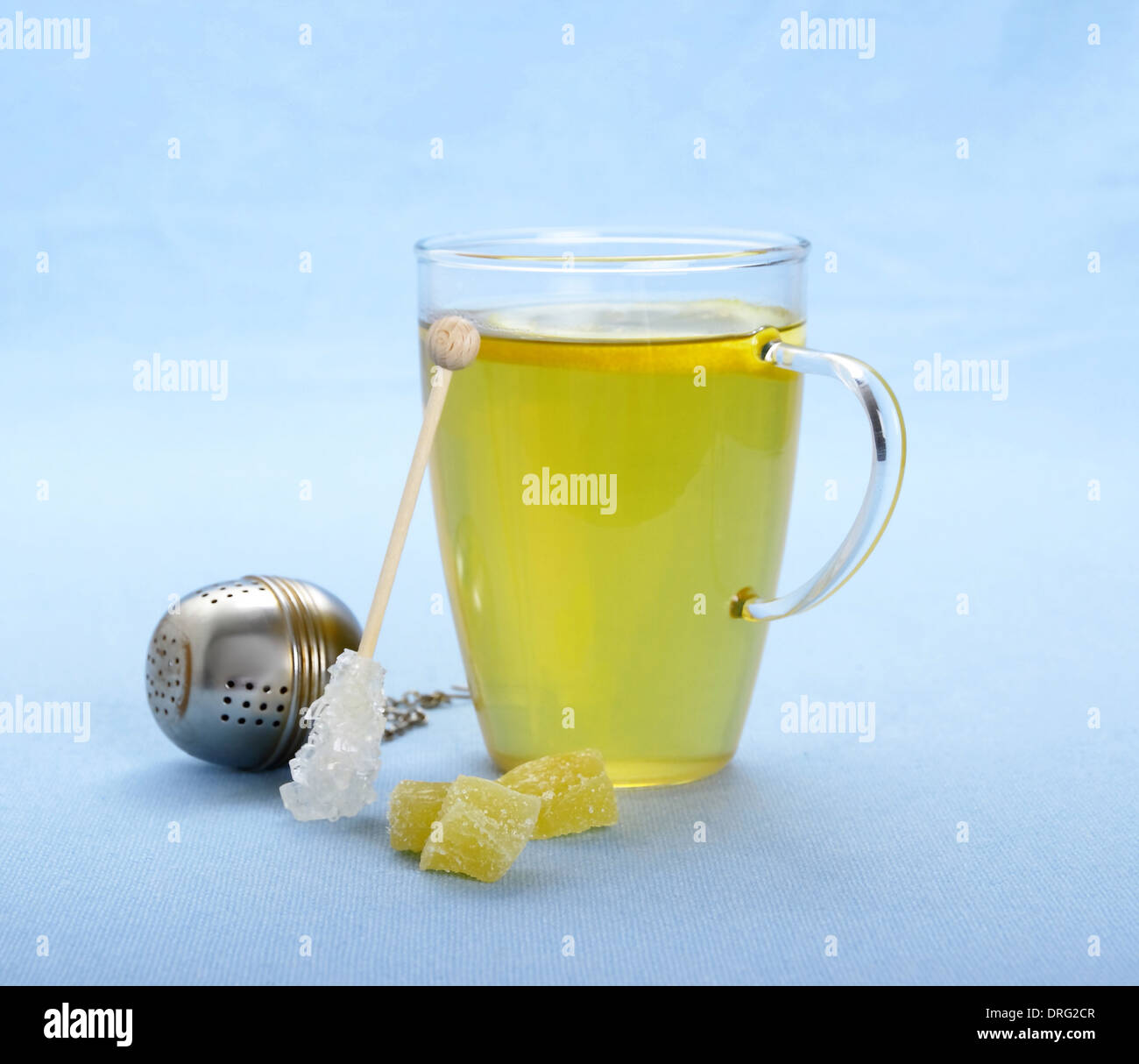 Green tea with sugared ginger and candy canes, close up Stock Photo - Alamy
