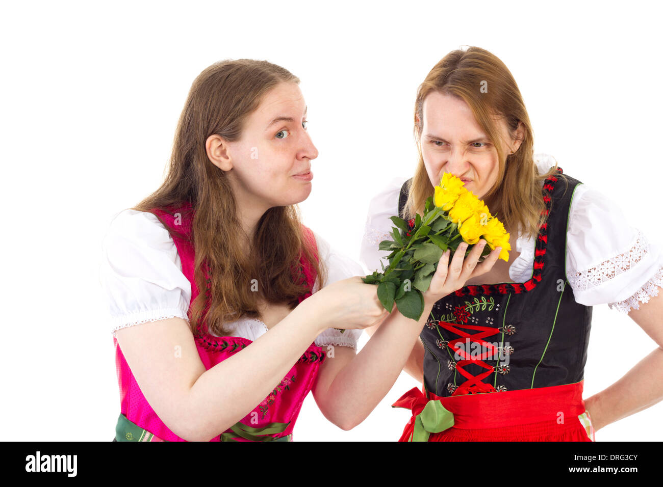 Beautiful mother thinks that these yellow roses stink Stock Photo - Alamy