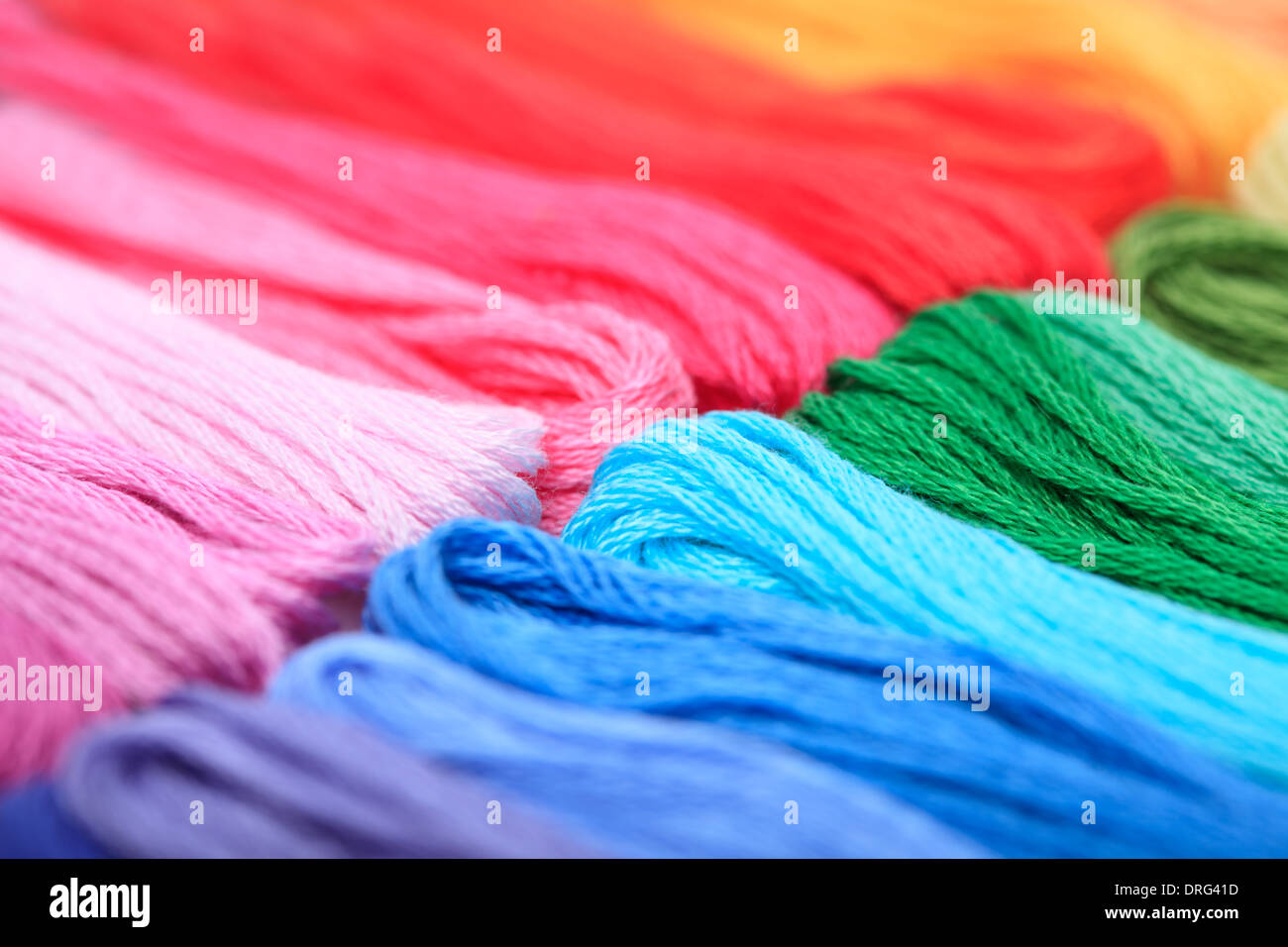 Close up embroidery floss, rainbow colours Stock Photo - Alamy