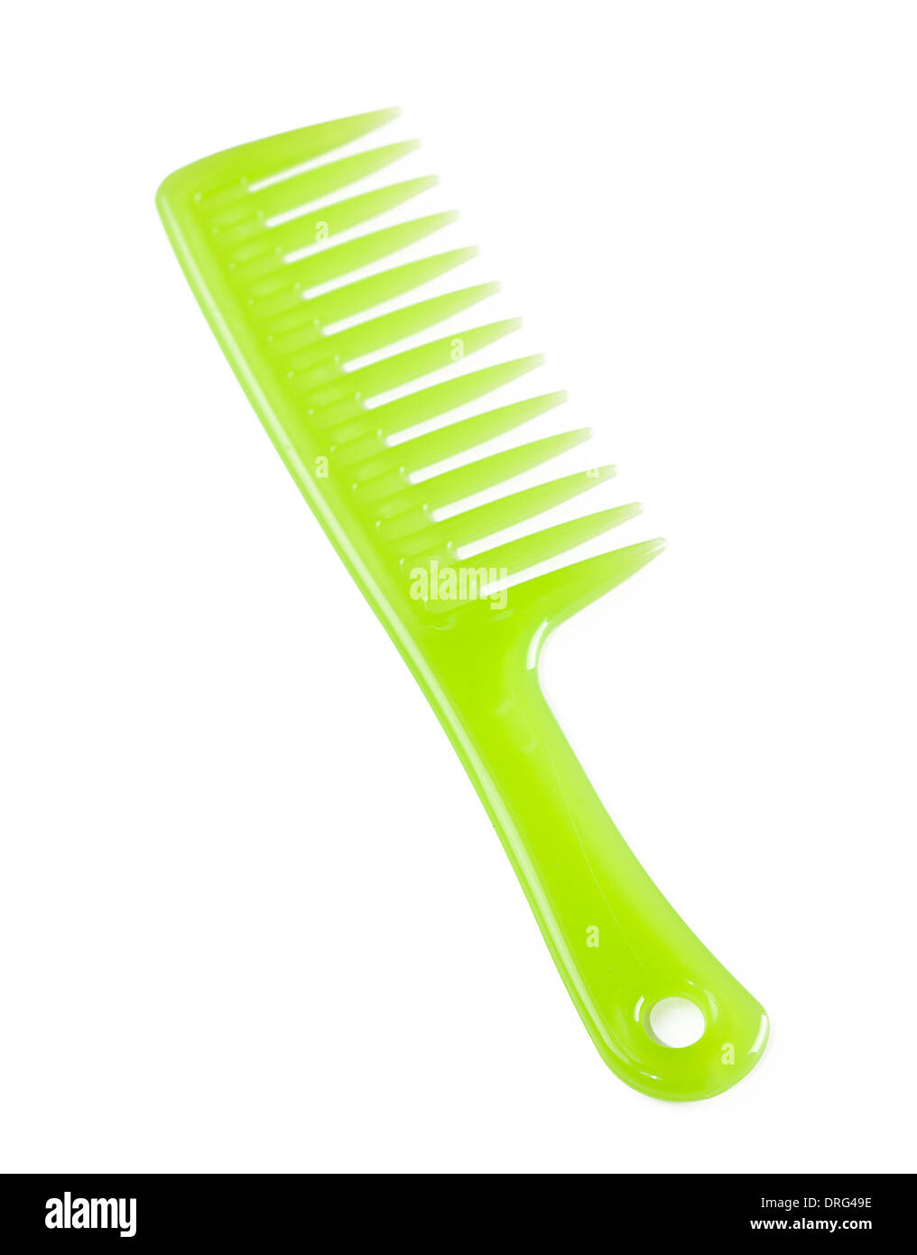 Green plastic comb isolated on a white background Stock Photo - Alamy